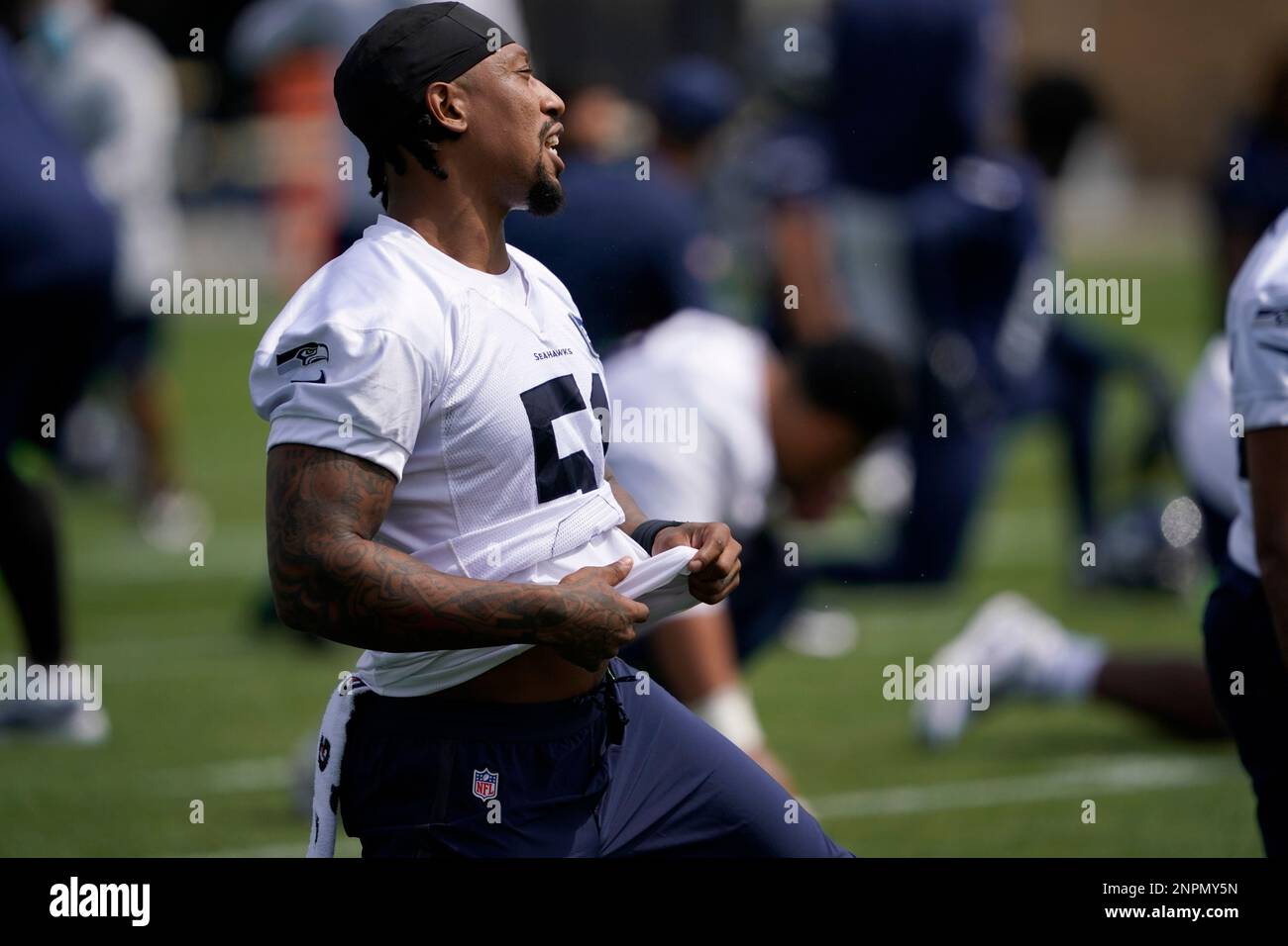 Seattle Seahawks linebacker Bruce Irvin reacts as he stretches at the ...