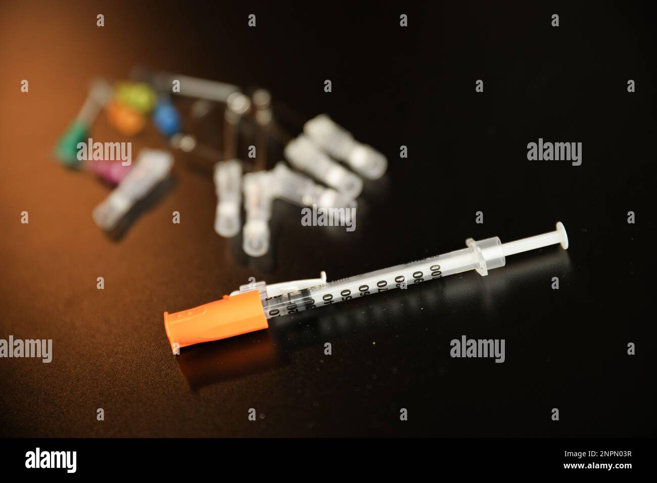 flu vaccine and needle syringes showing opioid crisis needle therapy ...