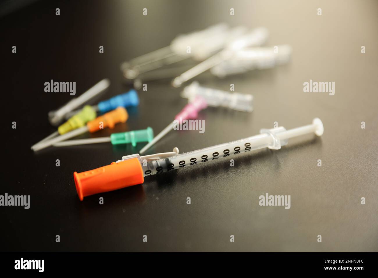 flu vaccine and needle syringes showing opioid crisis needle therapy ...