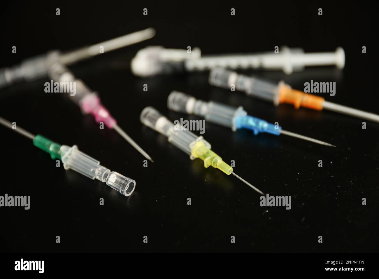 flu vaccine and needle syringes showing opioid crisis needle therapy ...
