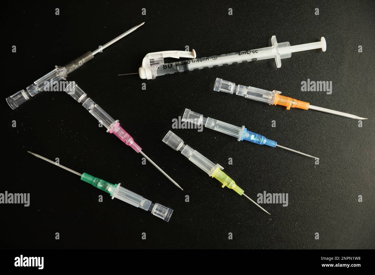 flu vaccine and needle syringes showing opioid crisis needle therapy ...
