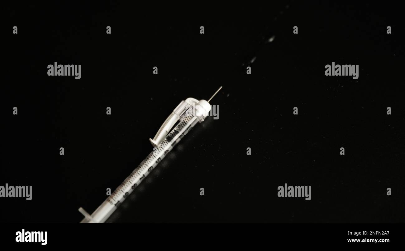 flu vaccine and needle syringes showing opioid crisis needle therapy ...