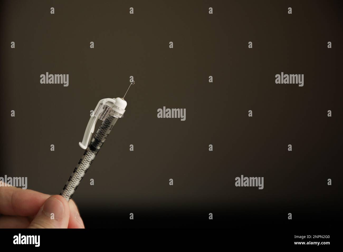 flu vaccine and needle syringes showing opioid crisis needle therapy ...