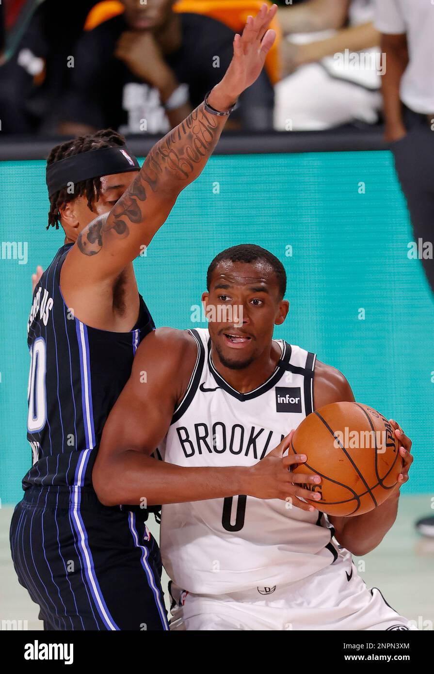 Brooklyn Nets' Jeremiah Martin (0) drives past Orlando Magic's Markelle ...