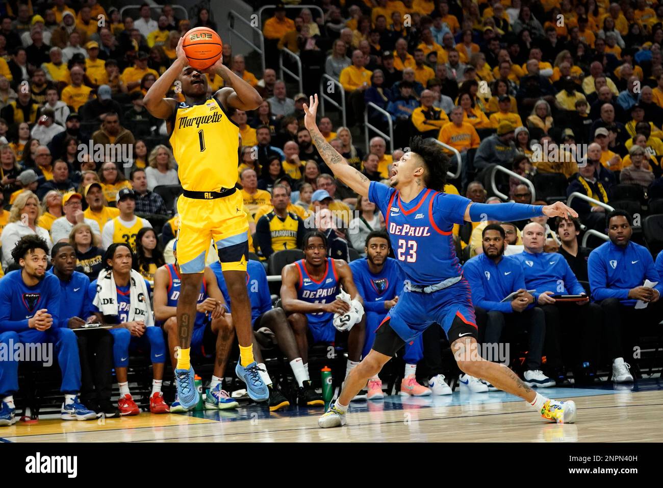 Marquette's Kam Jones (1) shoots against DePaul's Caleb Murphy during ...