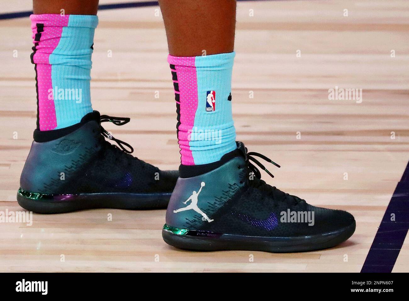 Miami Heat forward Jimmy Butler stands on the court during the first ...