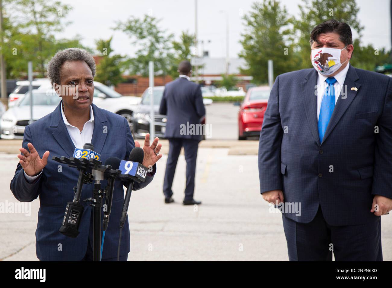 Mayor Lori Lightfoot, left, and Gov. J.B. Pritzker, right, respond to ...