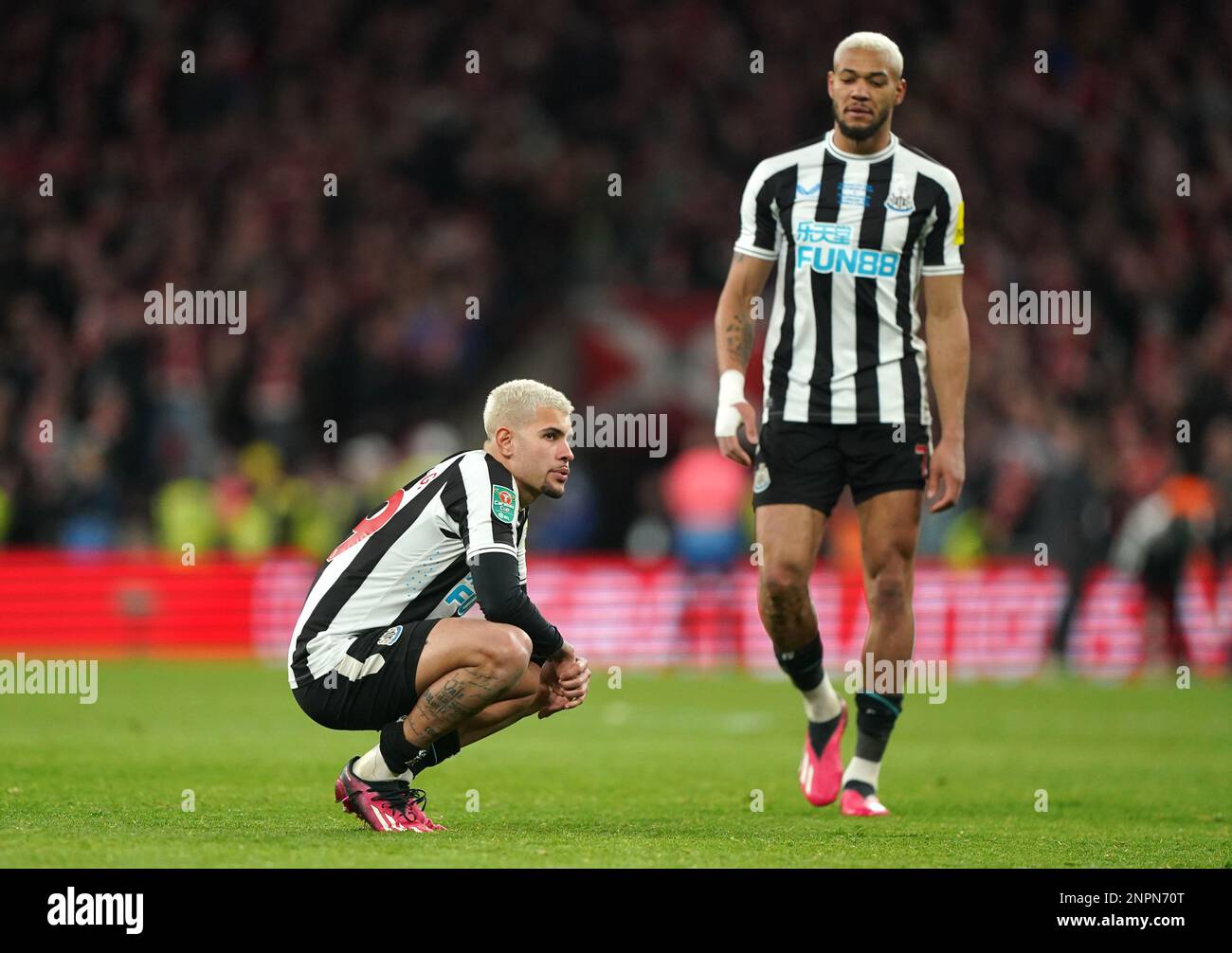 Newcastle United's Bruno Guimaraes (left) and Joelinton look dejected ...