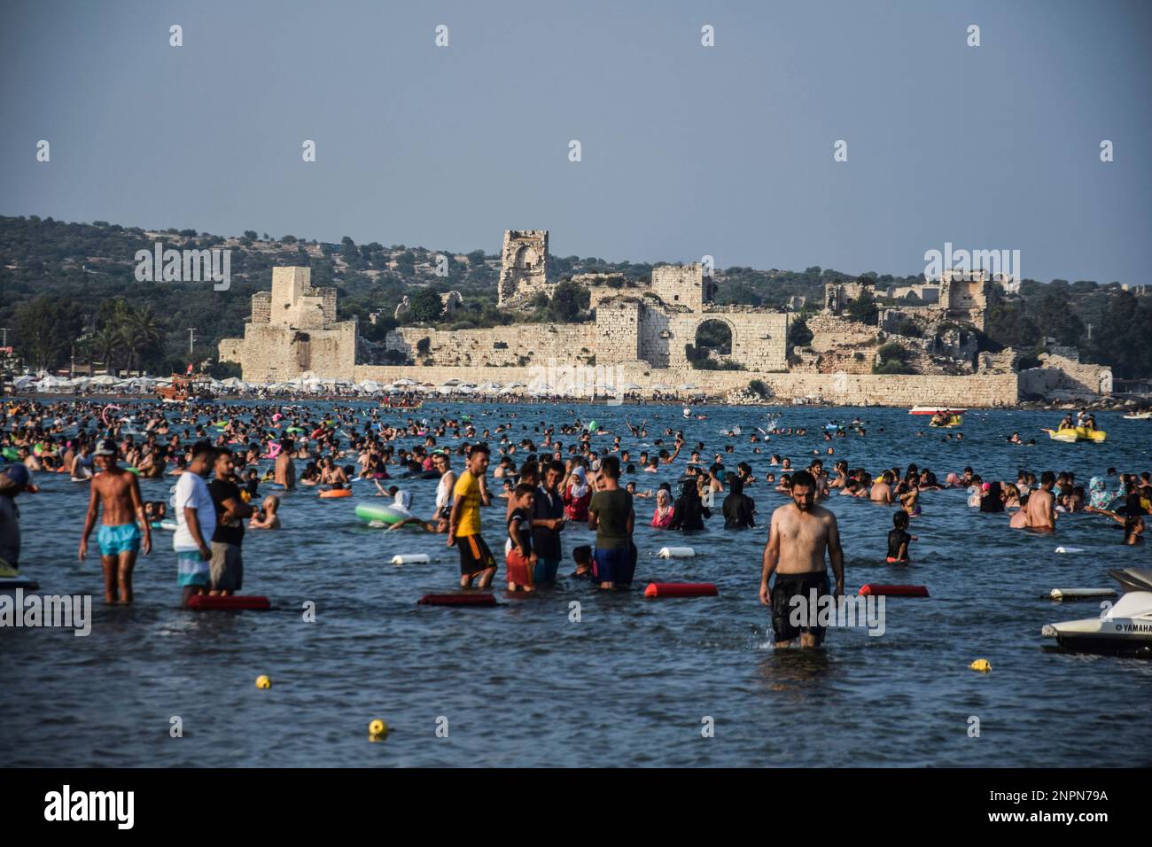 People enjoy the summer on the beach in Mersin, Turkey, on August 9 ...