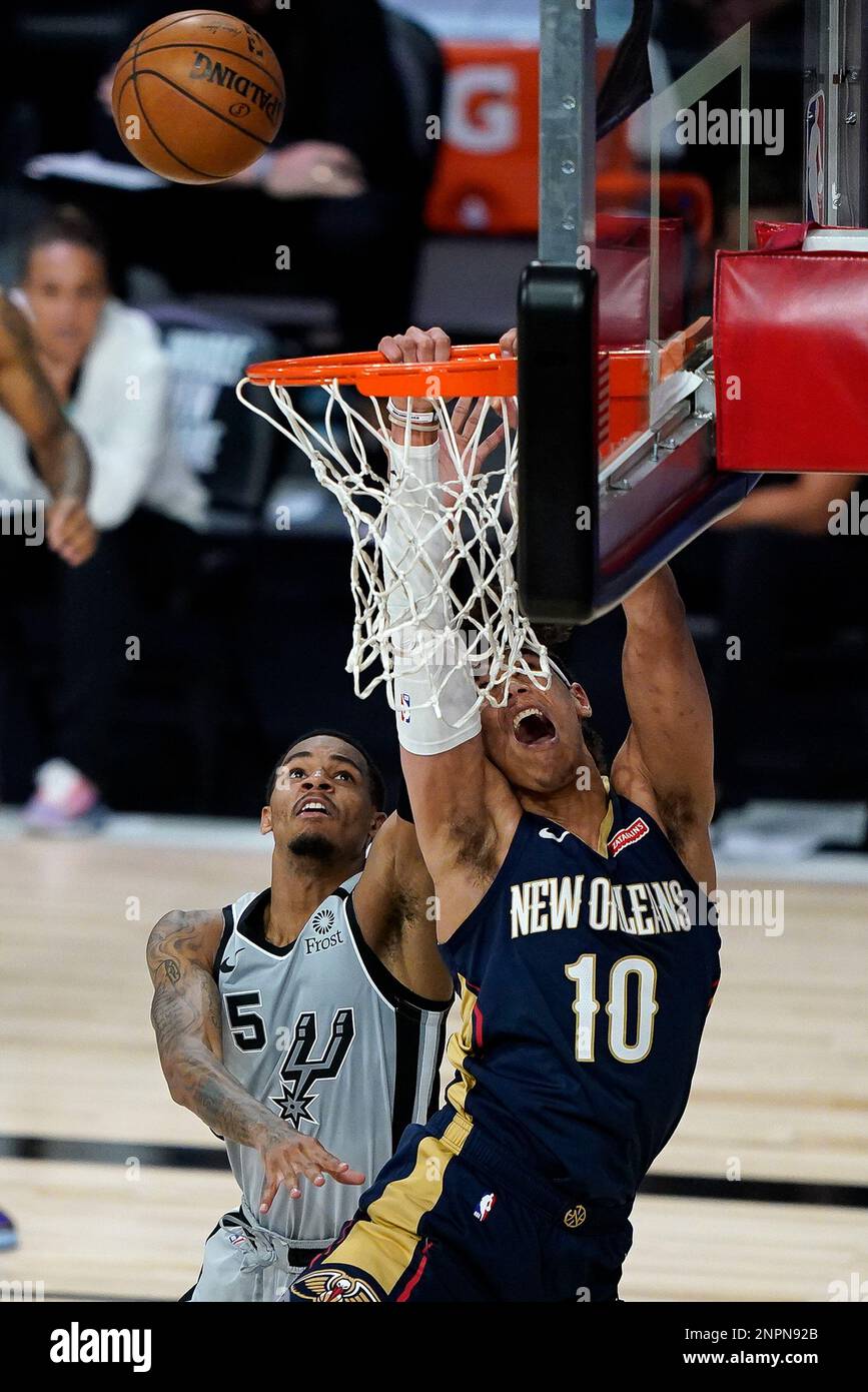 San Antonio Spurs' Dejounte Murray (5) tries to stop New Orleans ...