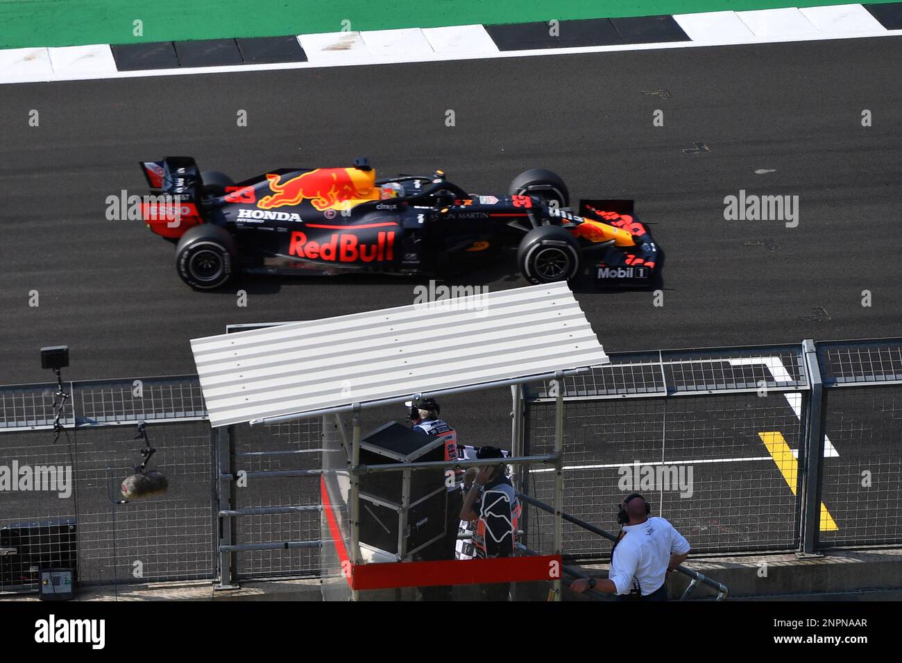 Red Bull driver Max Verstappen of the Netherlands crosses the finish ...