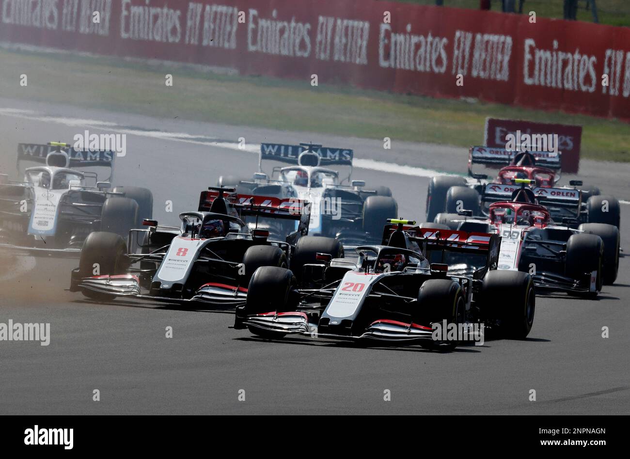 Haas driver Kevin Magnussen of Denmark, center, steers his car during ...