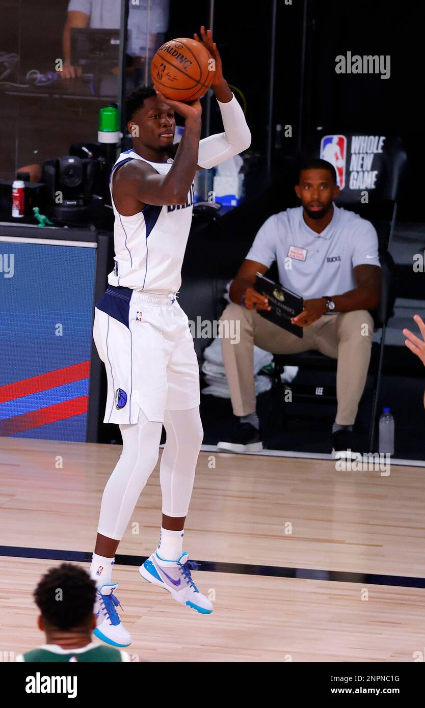 Dallas Mavericks' Dorian Finney-Smith shoots a three-point basket ...