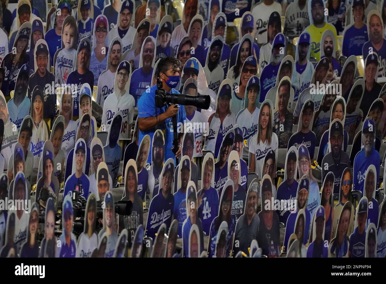 Los Angeles Dodgers photographer Juan Ocampo takes photos among fan ...