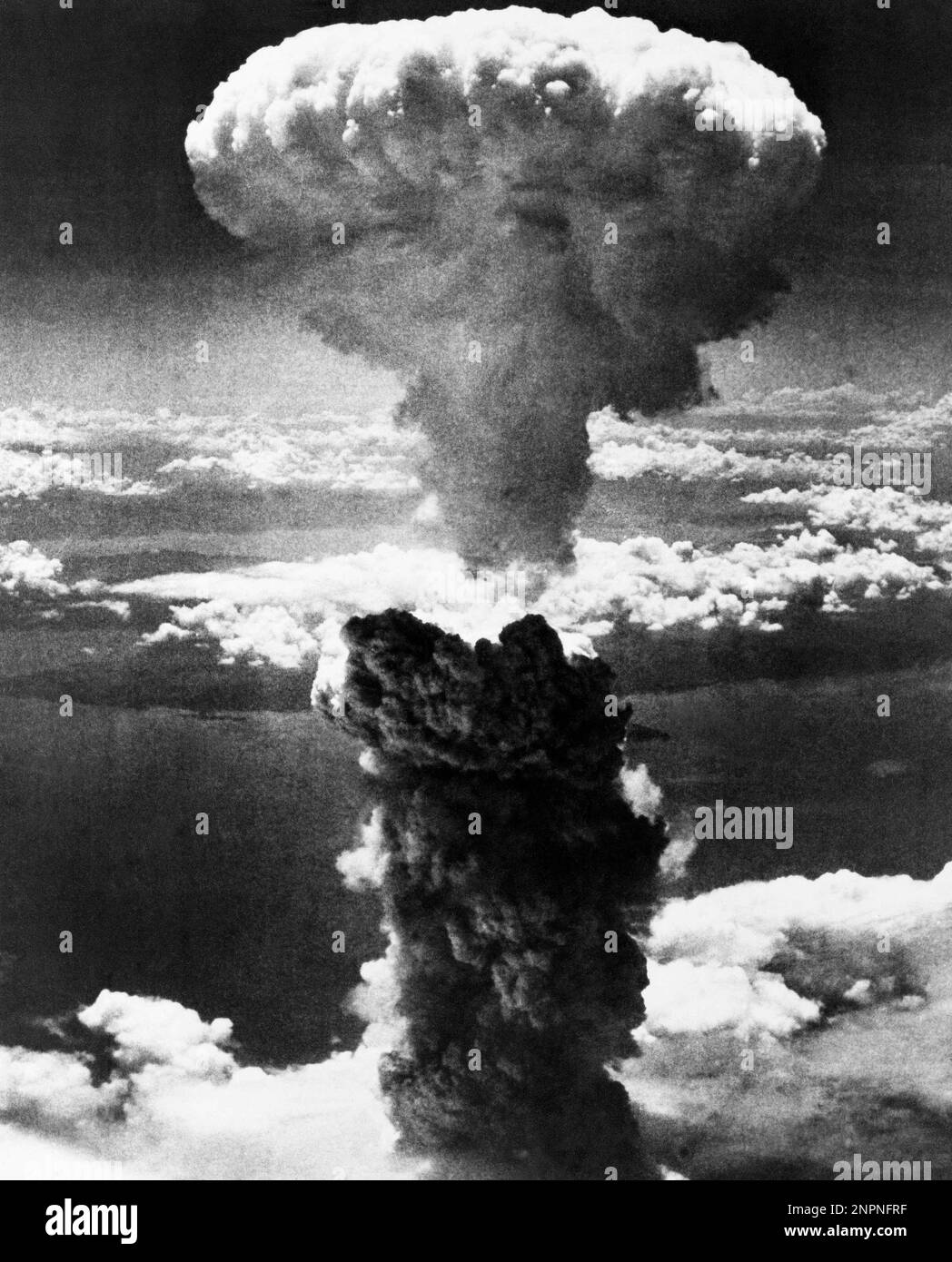 FILE - In this Aug. 9, 1945, file photo, a giant column of smoke rises ...