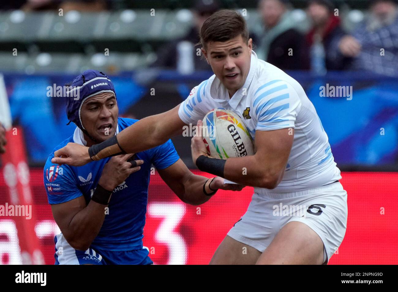 Argentina's Agustin Fraga, right, breaks away from Samoa's Paul Scanlan ...