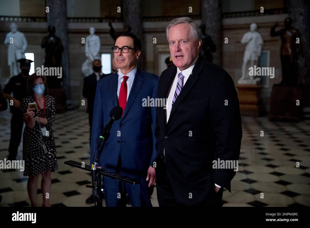 White House Chief of Staff Mark Meadows, right, accompanied by Treasury Secretary Steven Mnuchin ...