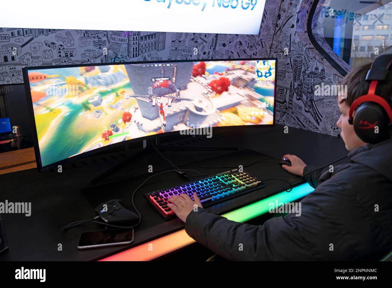 Teenage boy child playing computer game games on the Samsung KX Gaming ...