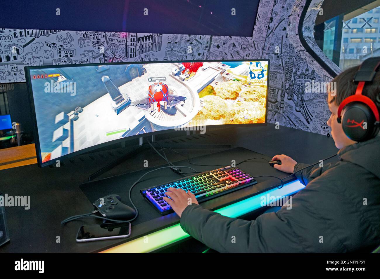 Teenage boy child teen playing video game games on Samsung KX Gaming ...