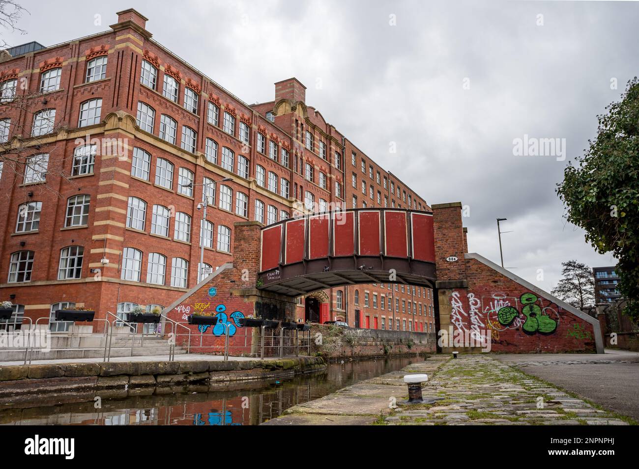 The iconic red Kitty Footbridge seen in front of the Royal Mill ...