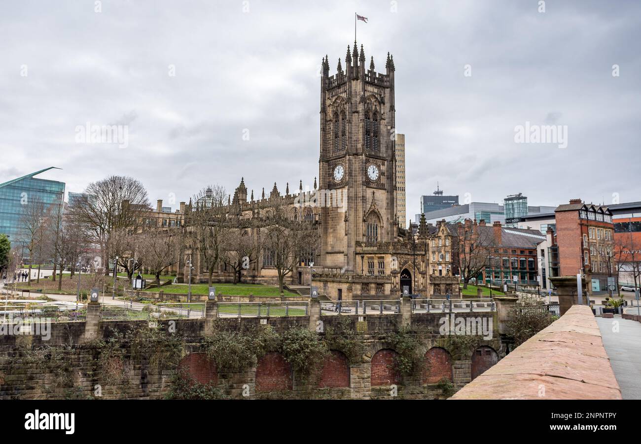 Manchester Cathedral seen from Cathedral Approach over the Irwell River ...