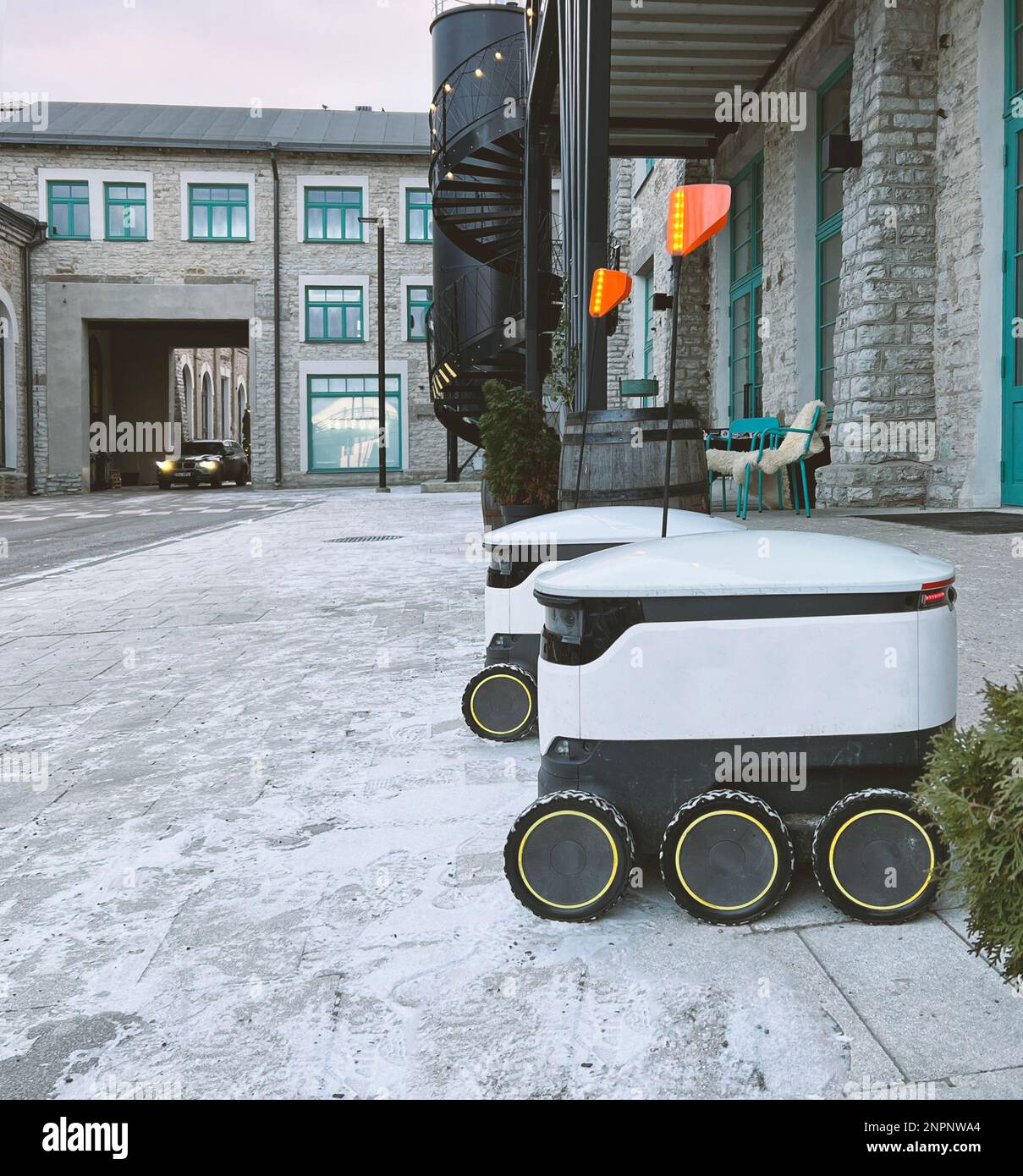 Autonomous delivery robot waiting for order at cafe or restaurant ...