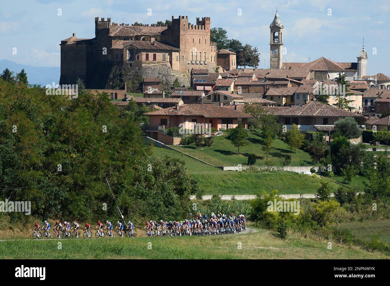 Cyclists make their way through a rural landscape during the Milano ...