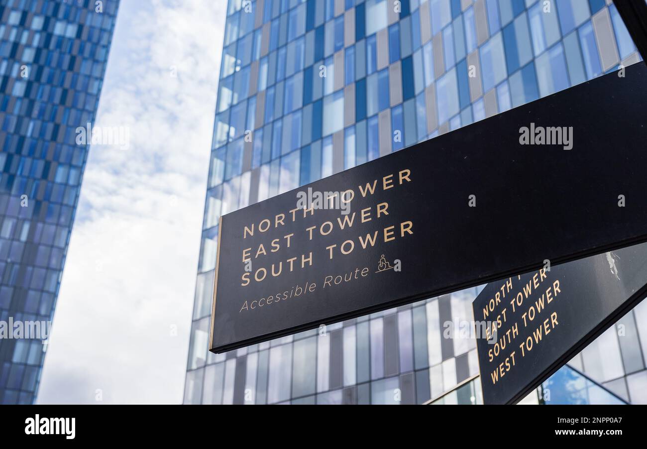 A sign post on the street next to the Deansgate Square skyscraper ...
