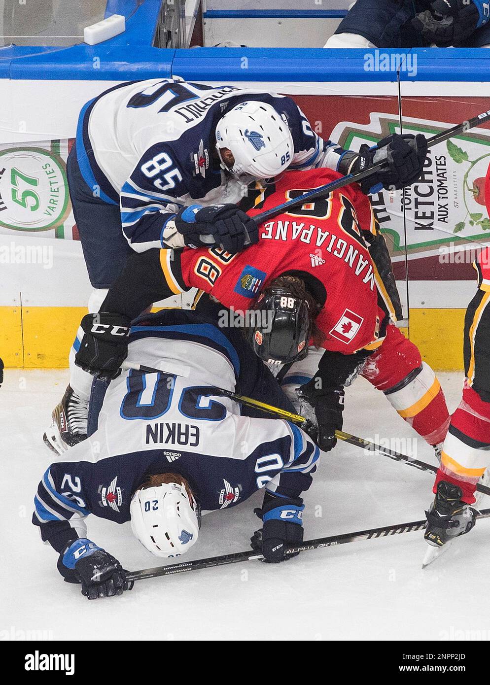 Winnipeg Jets' Mathieu Perreault (85), Cody Eakin and Calgary Flames ...