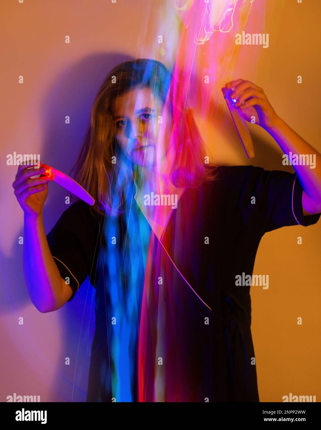 Portrait of a professional manicurist in a uniform in trendy style and ...