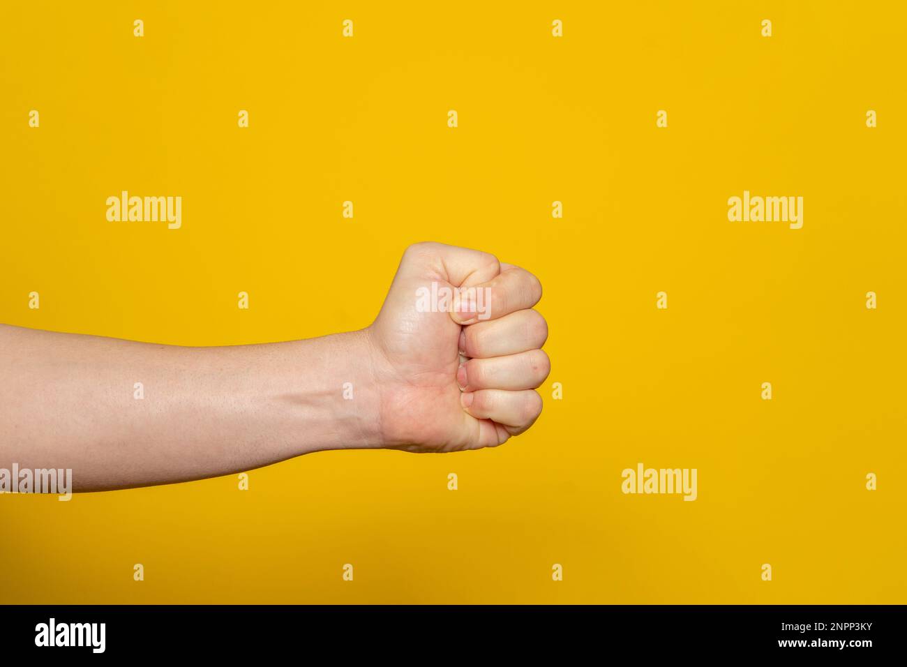 Strong man's hand in the form of a fist horizontally, isolated on ...