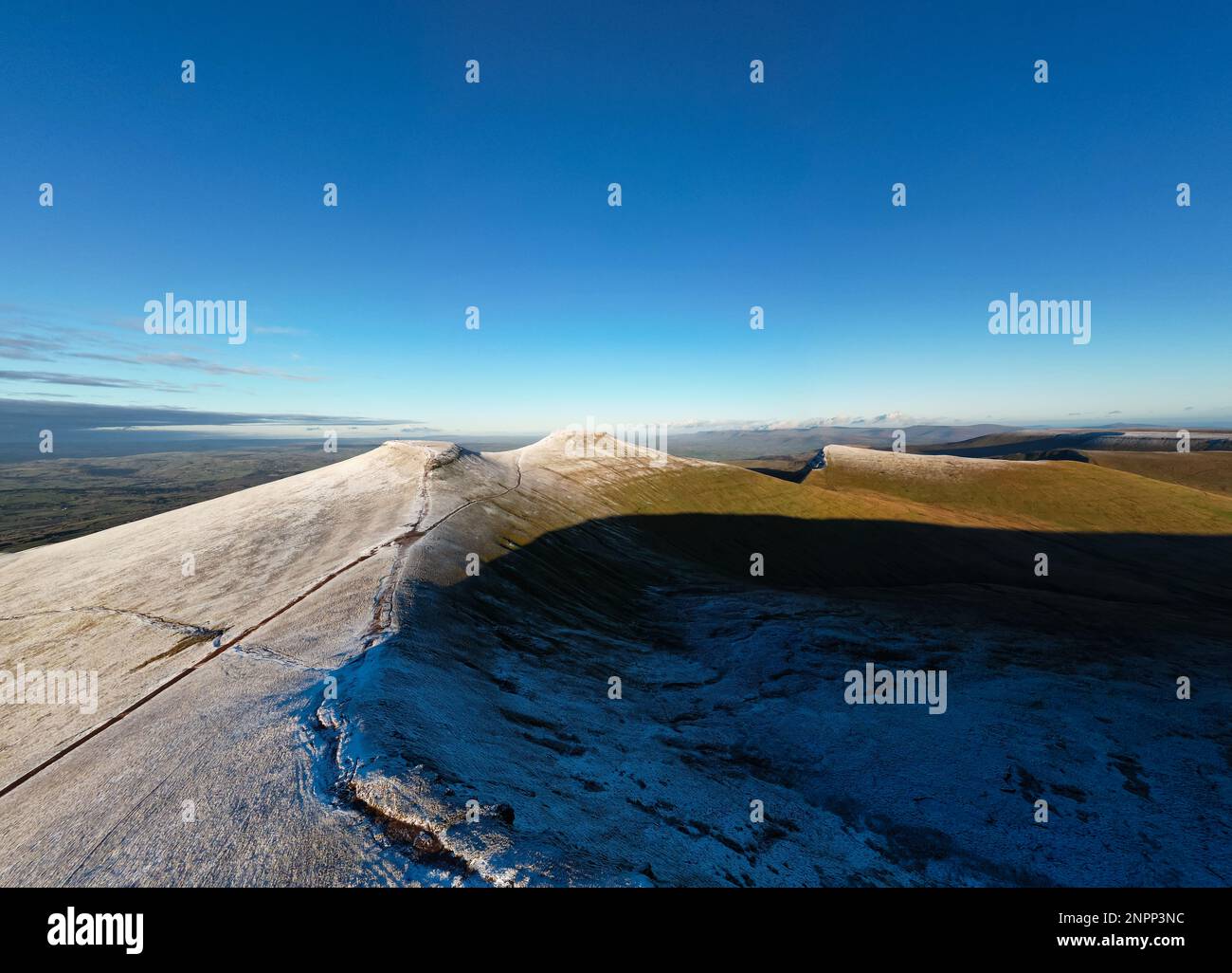 Aerial view of a snow capped Corn Du, Pen-y-Fan and Cribyn in the ...