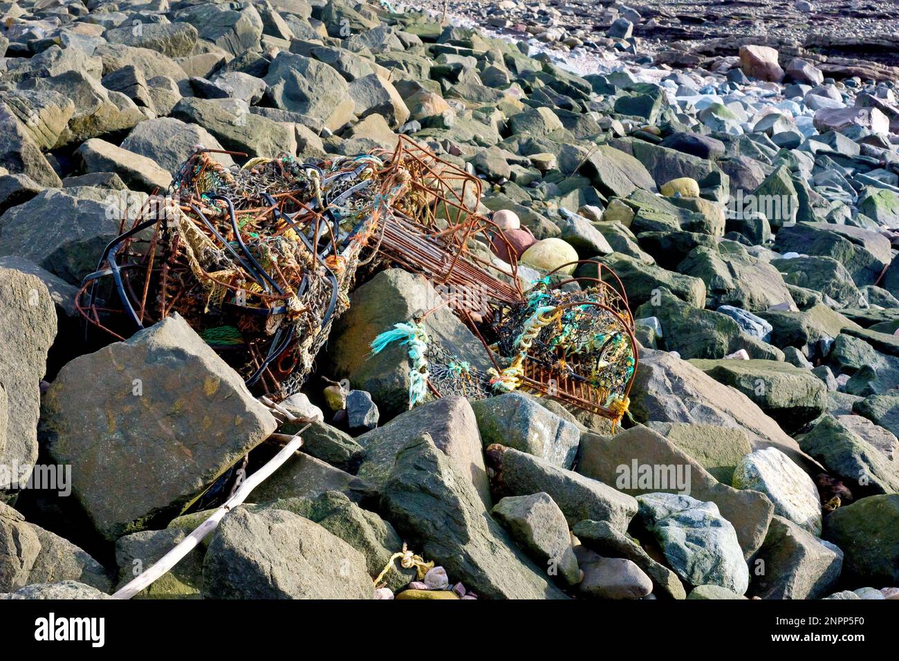 Close up of a tangled, broken pile of crab pots, creels and ropes ...