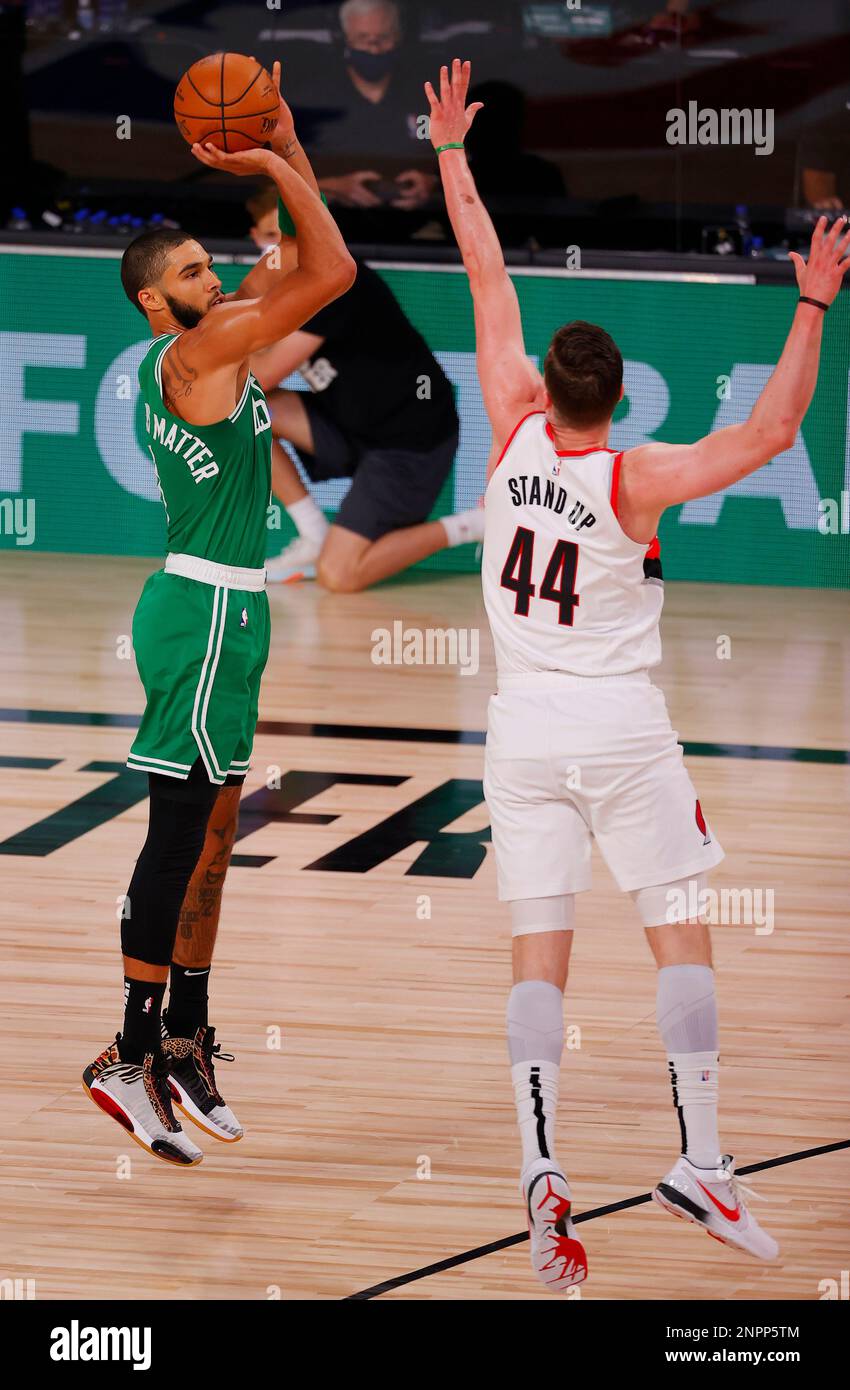 Boston Celtics' Jayson Tatum (0) shoots against Portland Trail Blazers ...