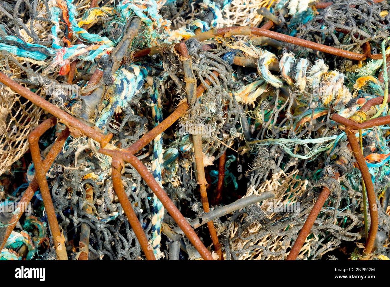 Close up of the tangled mess of rusting iron and nylon ropes and ...