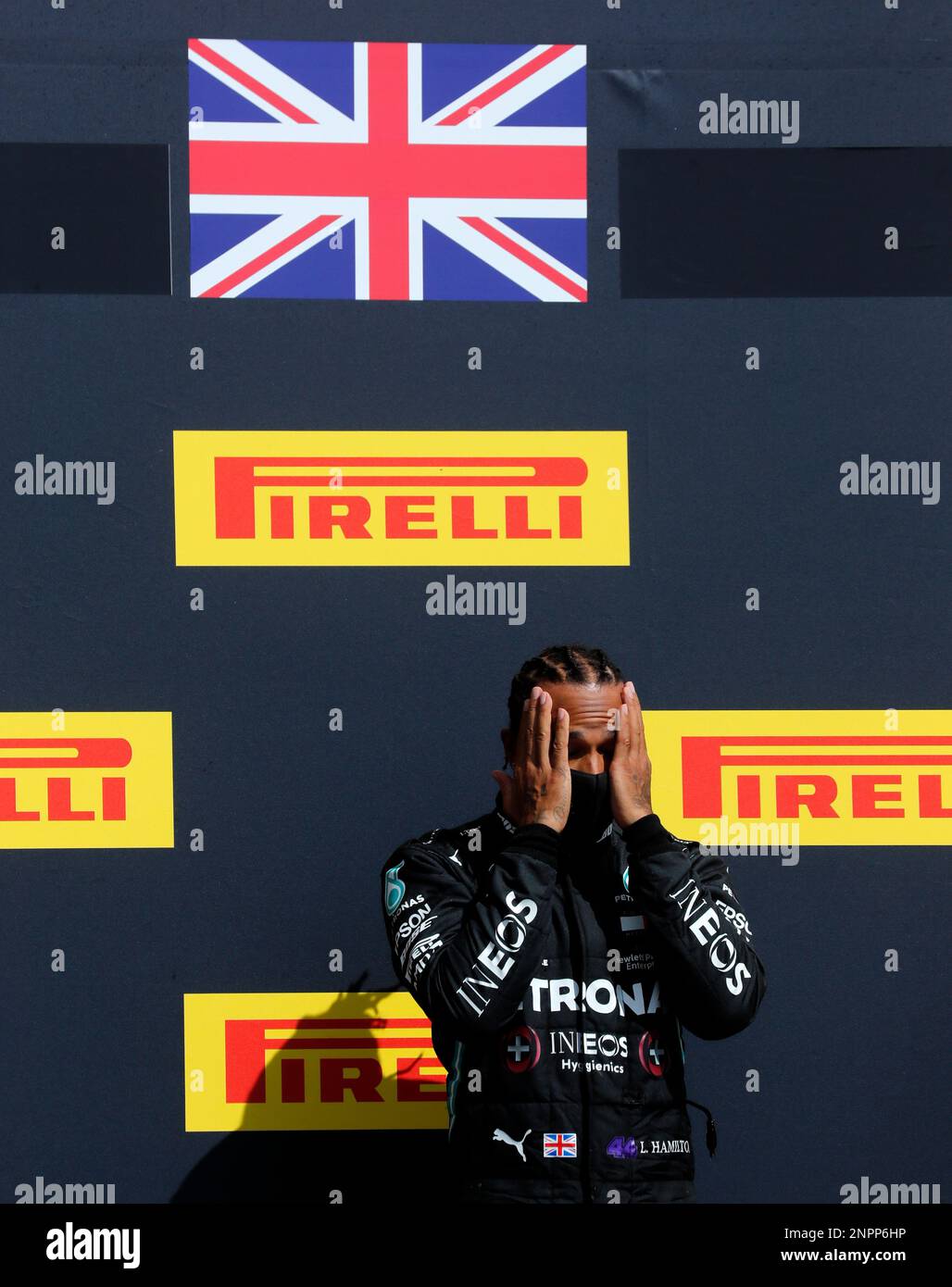 Mercedes driver Lewis Hamilton of Britain gestures at the podium after ...