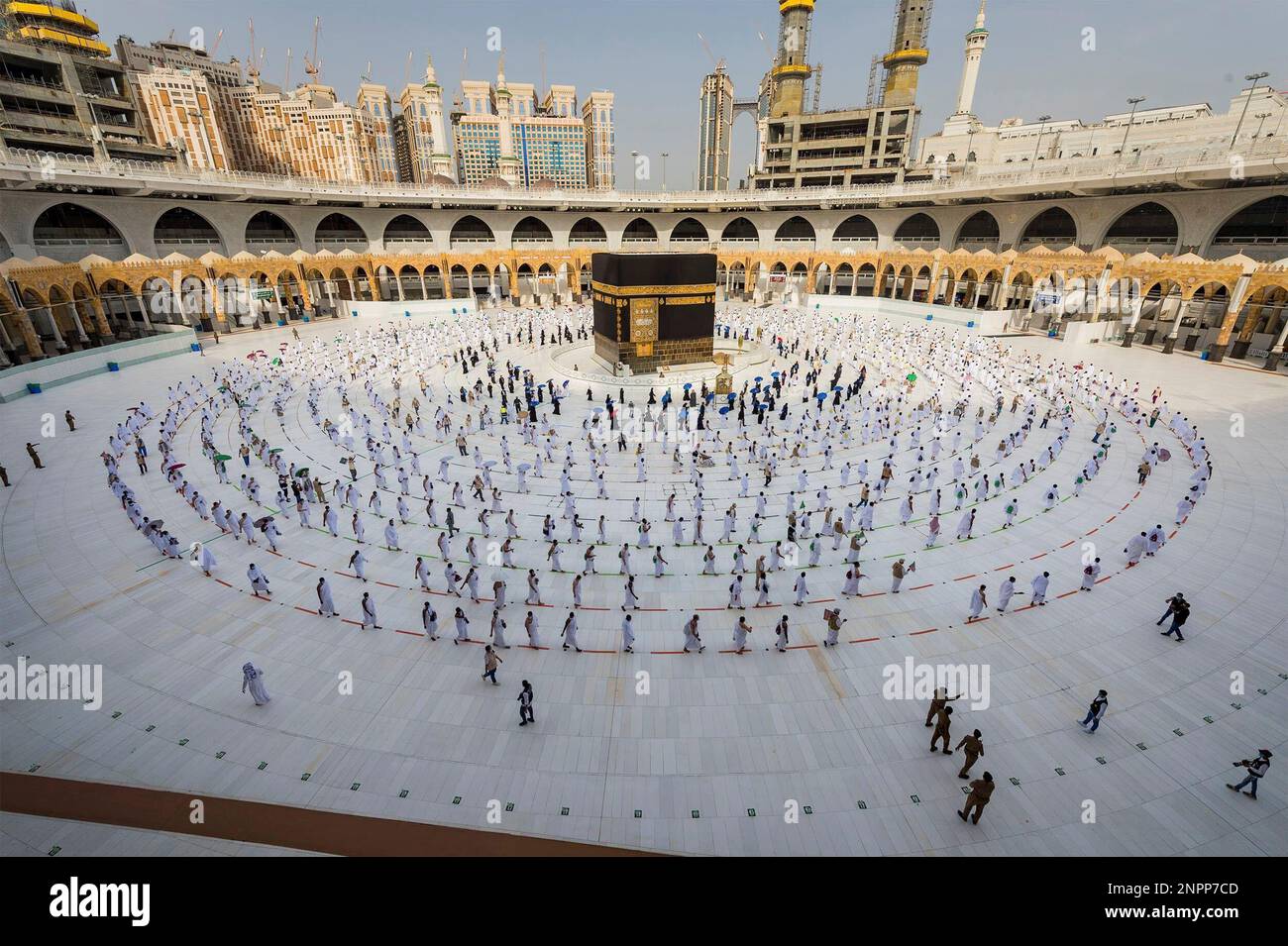 Pilgrims walk around the Kabba at the Grand Mosque, in the Muslim holy ...