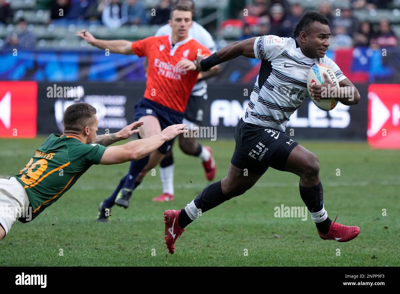 Fiji's Jerry Tuwai, right, breaks away from South Africa's Ricardo ...