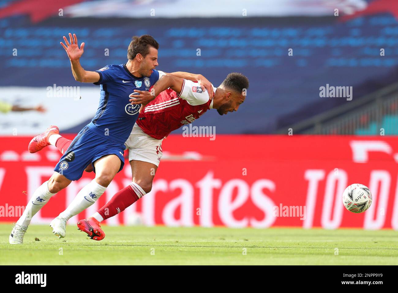Chelsea's Cesar Azpilicueta, left, fouls Arsenal's Pierre-Emerick ...