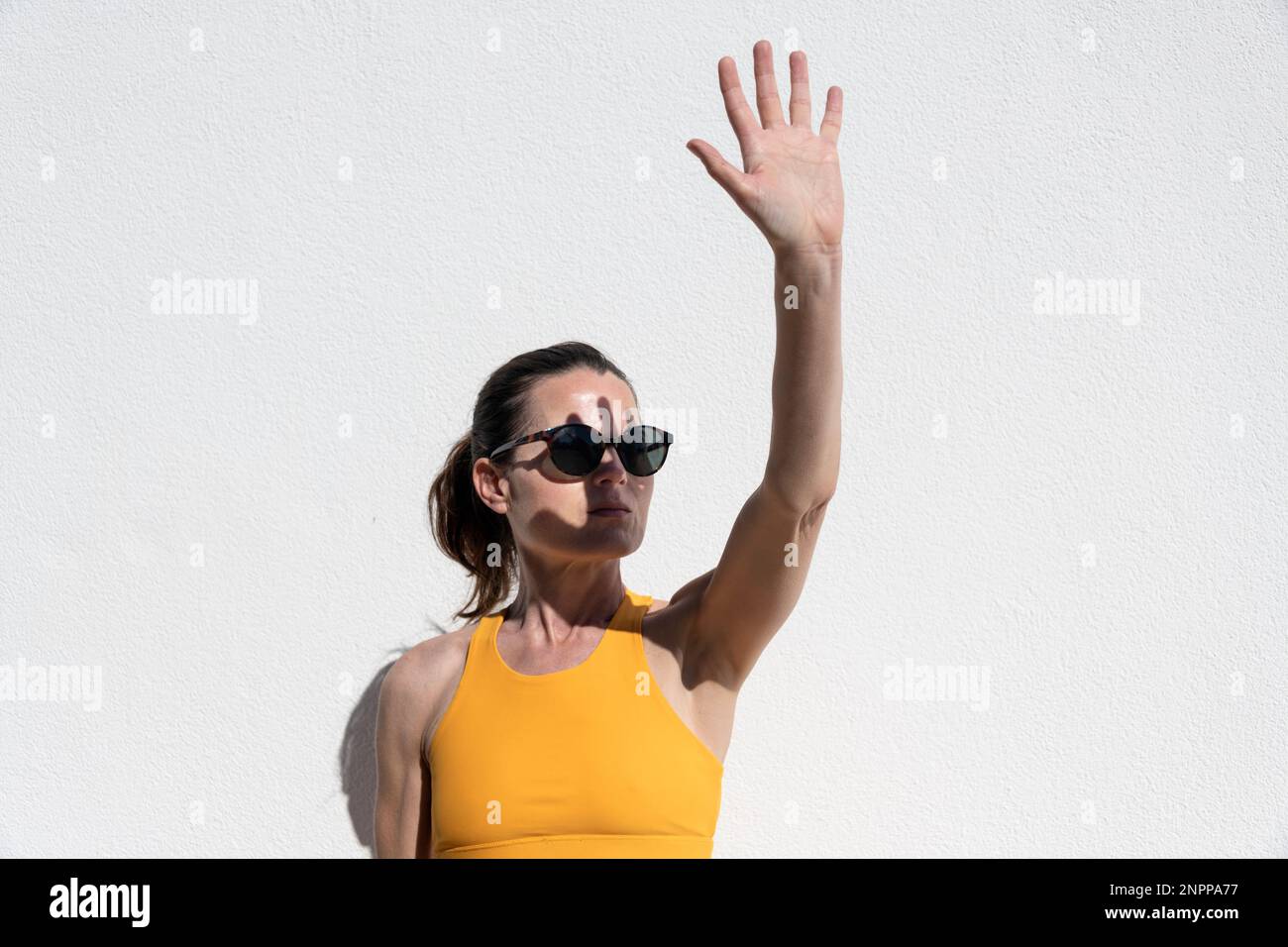 Hand shielding face from sun hi-res stock photography and images - Alamy