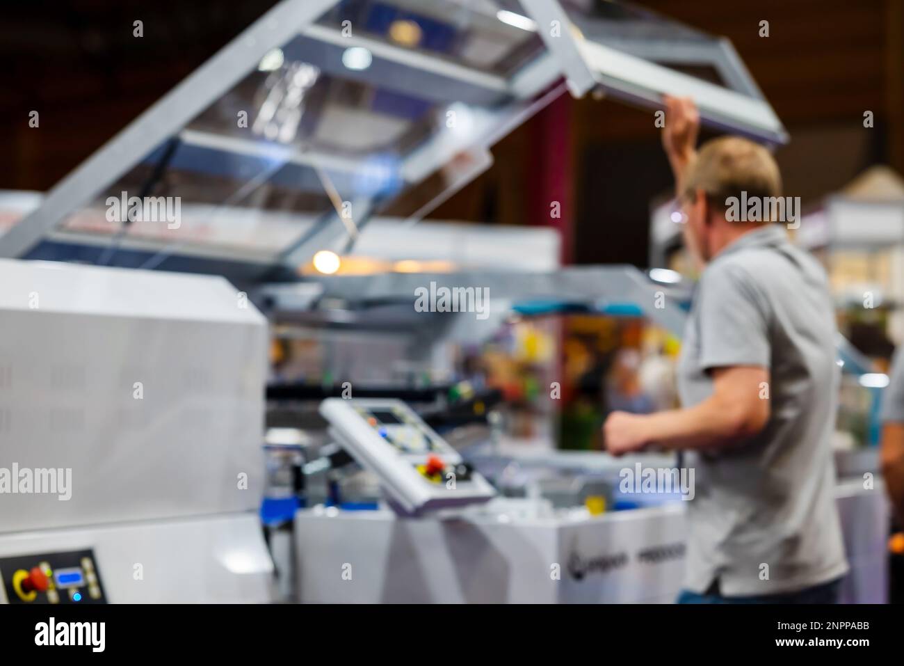 Blurred Shot Of Mechanic Standing Behind Control Panel On Packaging ...