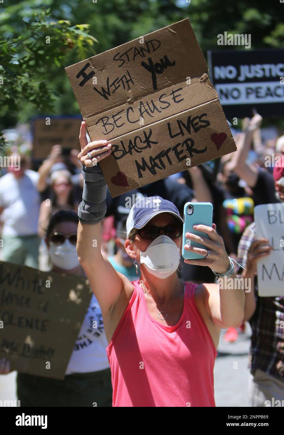 RICHMOND, VA – JUNE 13: A protester holding a sign during the Virginia ...