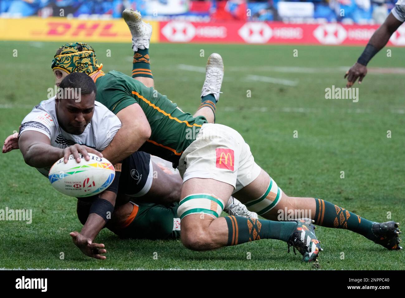 Fiji's Josua Vakurinabili, left, scores a try as South Africa's Impi ...