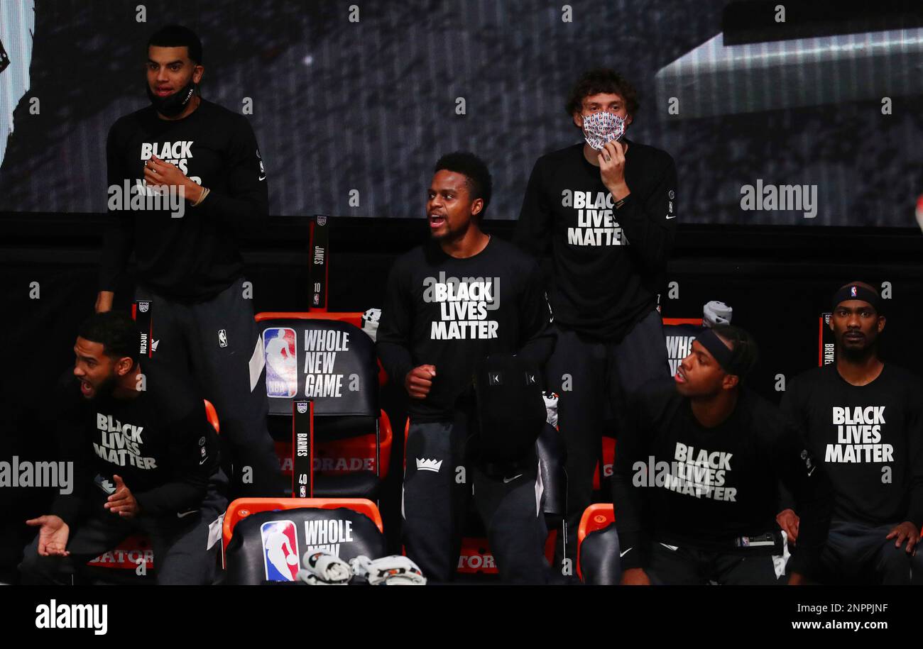 Sacramento Kings players cheer from the bench while wearing Black Lives ...