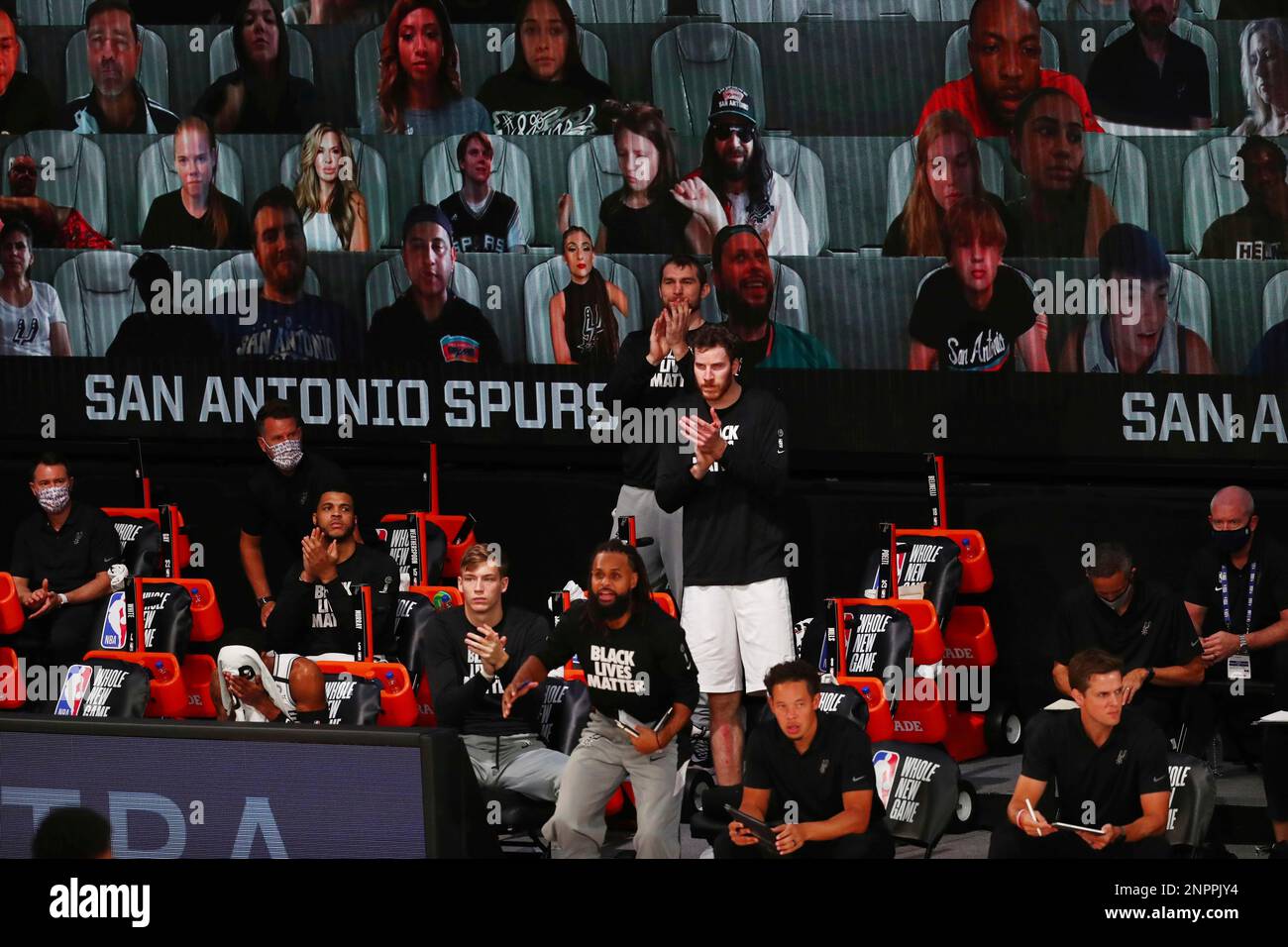Virtual fans are displayed on a video board behind the San Antonio ...