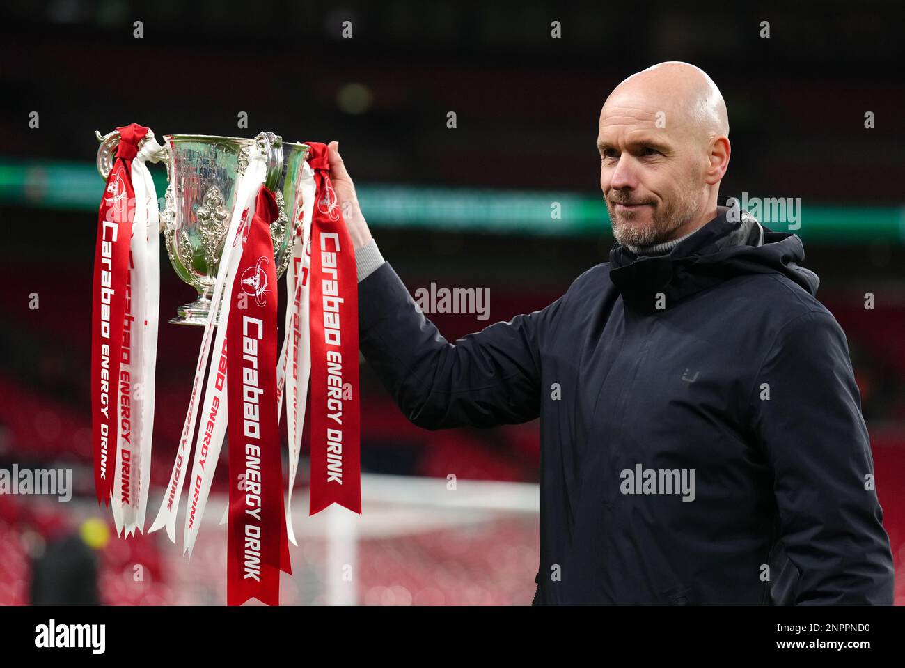 Manchester United manager Erik ten Hag lifts the trophy after winning ...