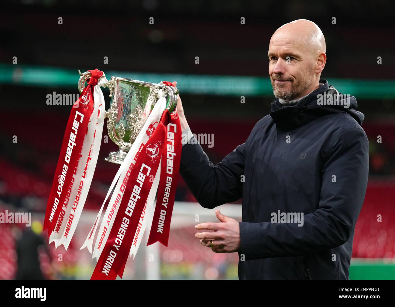 Manchester United manager Erik ten Hag lifts the trophy after winning ...