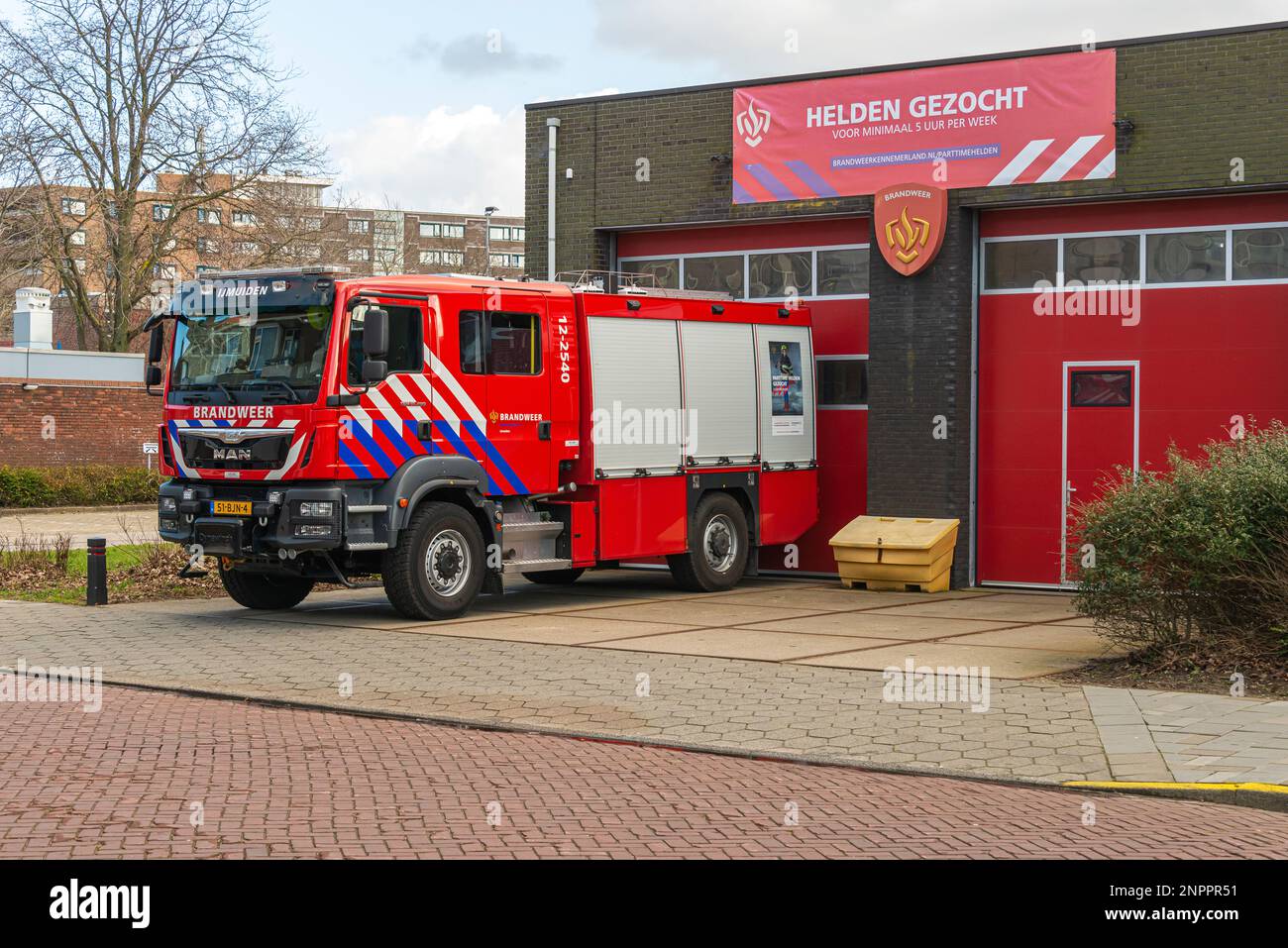 red fire engine parked outside in front of the barracks Stock Photo - Alamy
