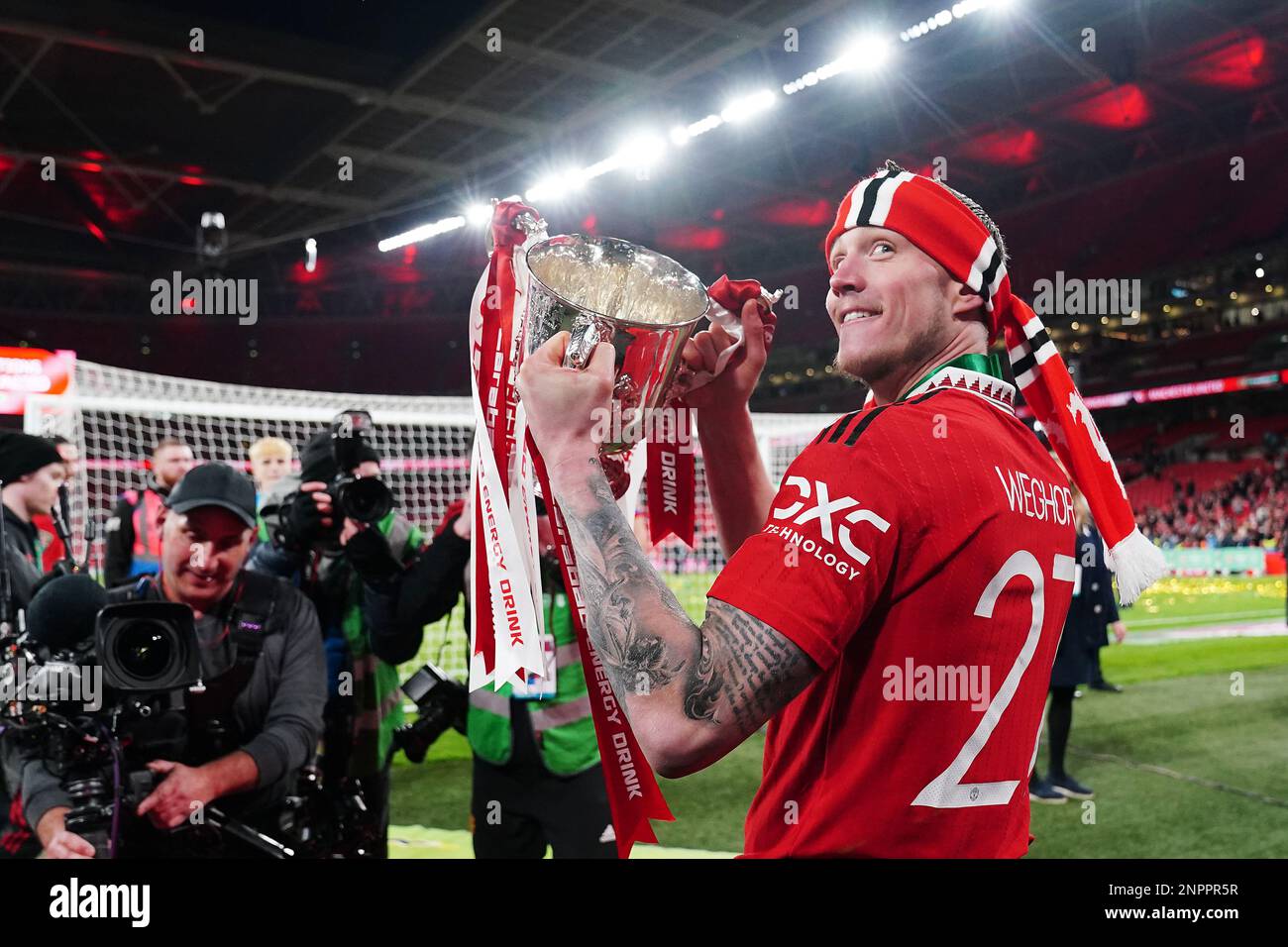 Manchester United's Wout Weghorst celebrates with the trophy following ...