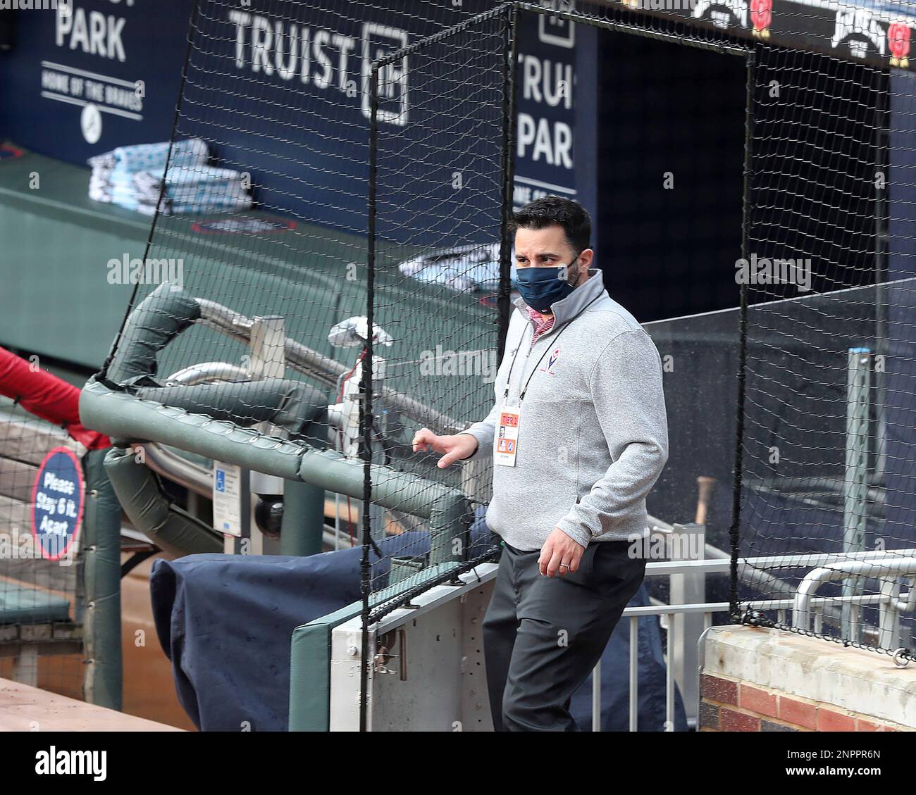 Atlanta Braves general manager Alex Anthopoulos wears a mask as he ...